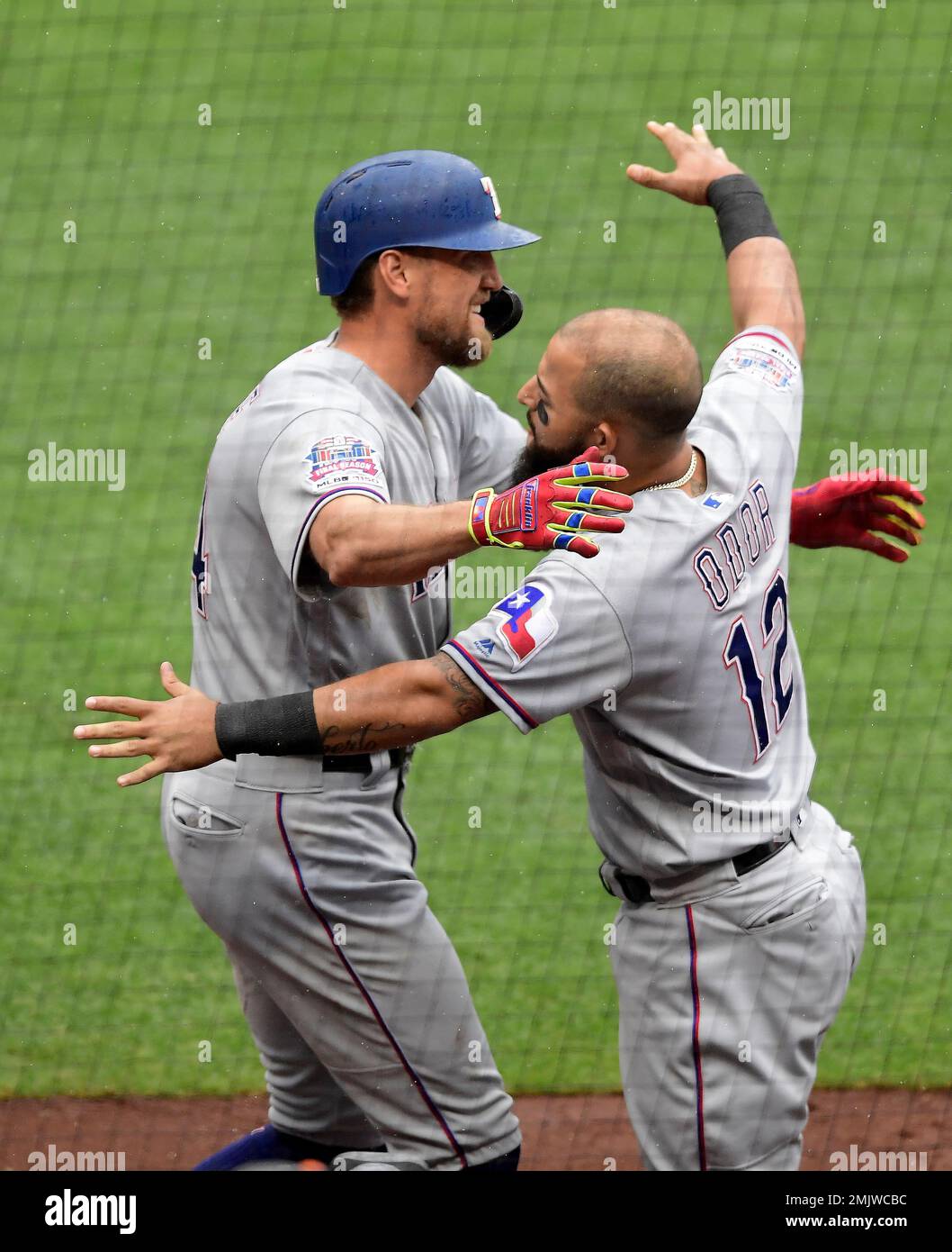 Texas Rangers' Hunter Pence, left, is congratulated by Rougned Odor ...