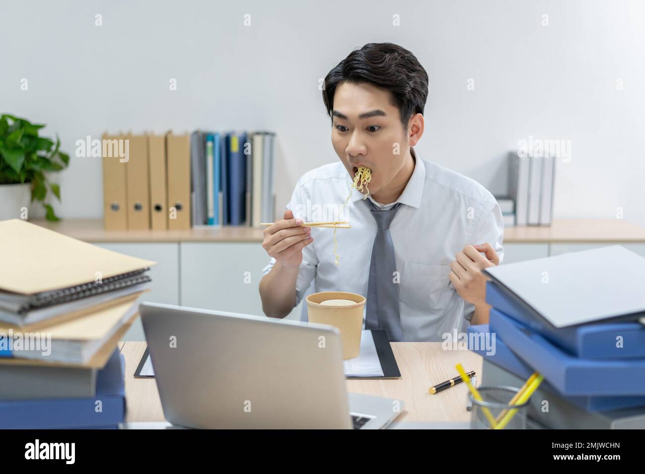 Business men in the office to work overtime Stock Photo - Alamy