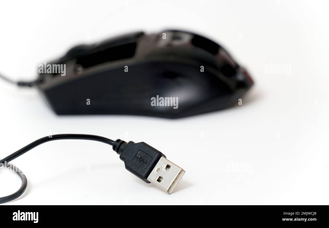 USB connection of a black out of order computer mouse on white ...