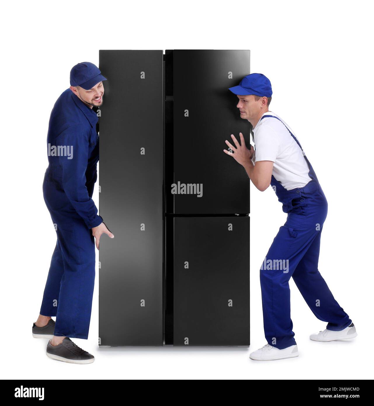 Professional workers carrying refrigerator on white background Stock ...