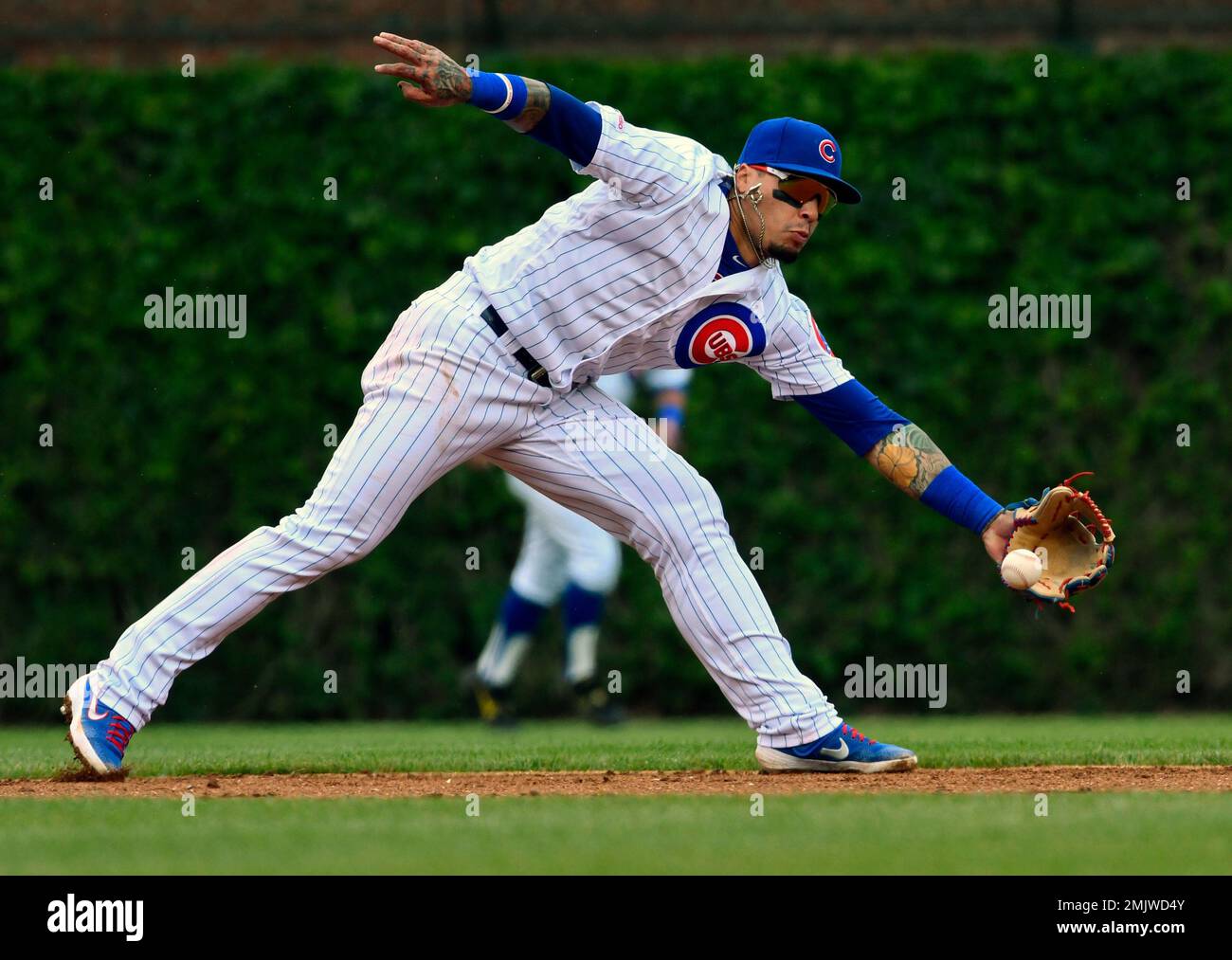 Chicago Cubs shortstop Javier Baez (9) catches a ball hit by Cincinnati ...