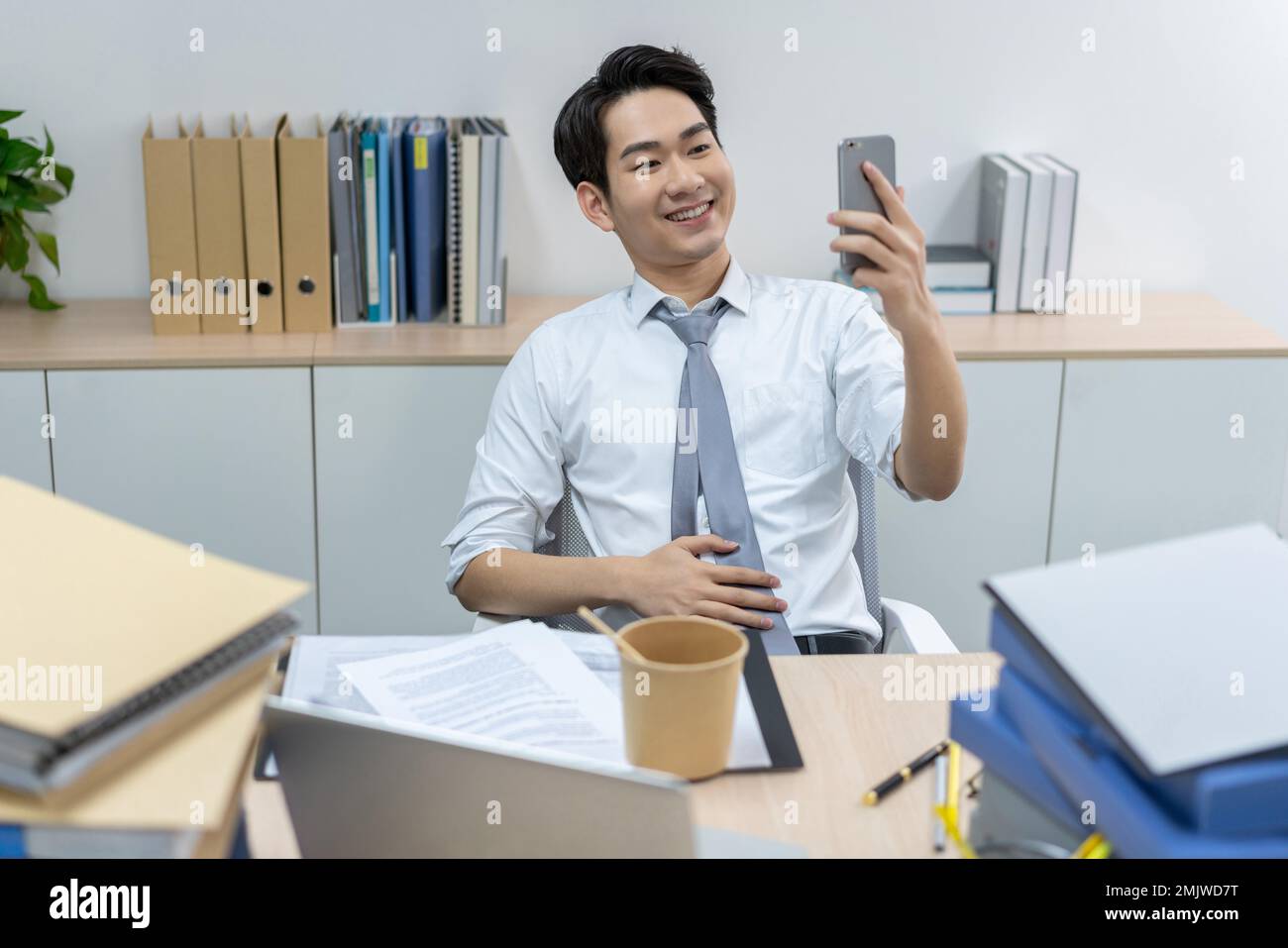 Happy business men in the office to work overtime Stock Photo - Alamy