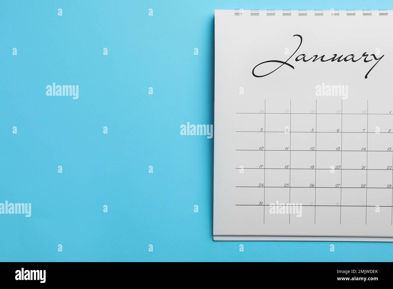 January calendar on light blue background, top view. Space for text ...