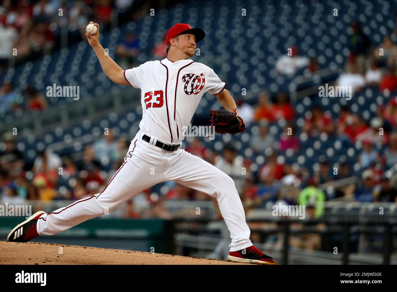 Washington Nationals pitcher Erick Fedde (23) winds up a pitch in the ...