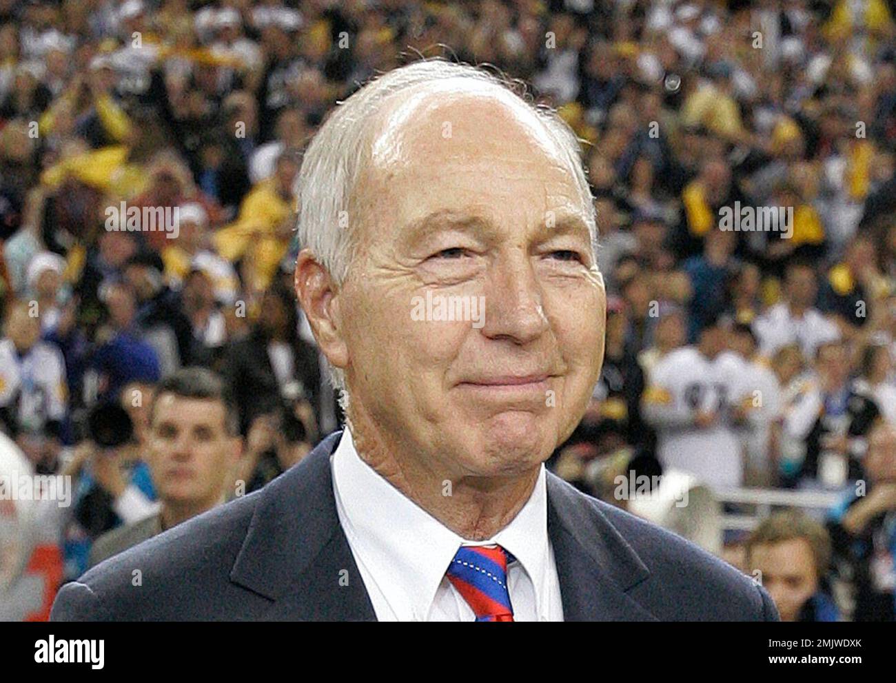 FILE - In this Feb. 5, 2006, file photo, former Green Bay Packers' Bart Starr carries in the ...