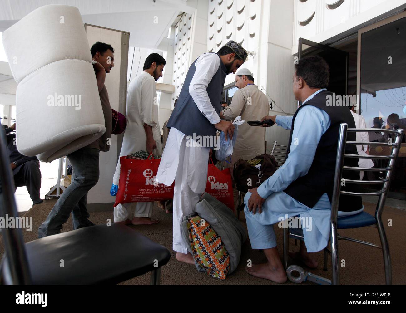 A security officer checks Muslim worshippers arriving to observe ...