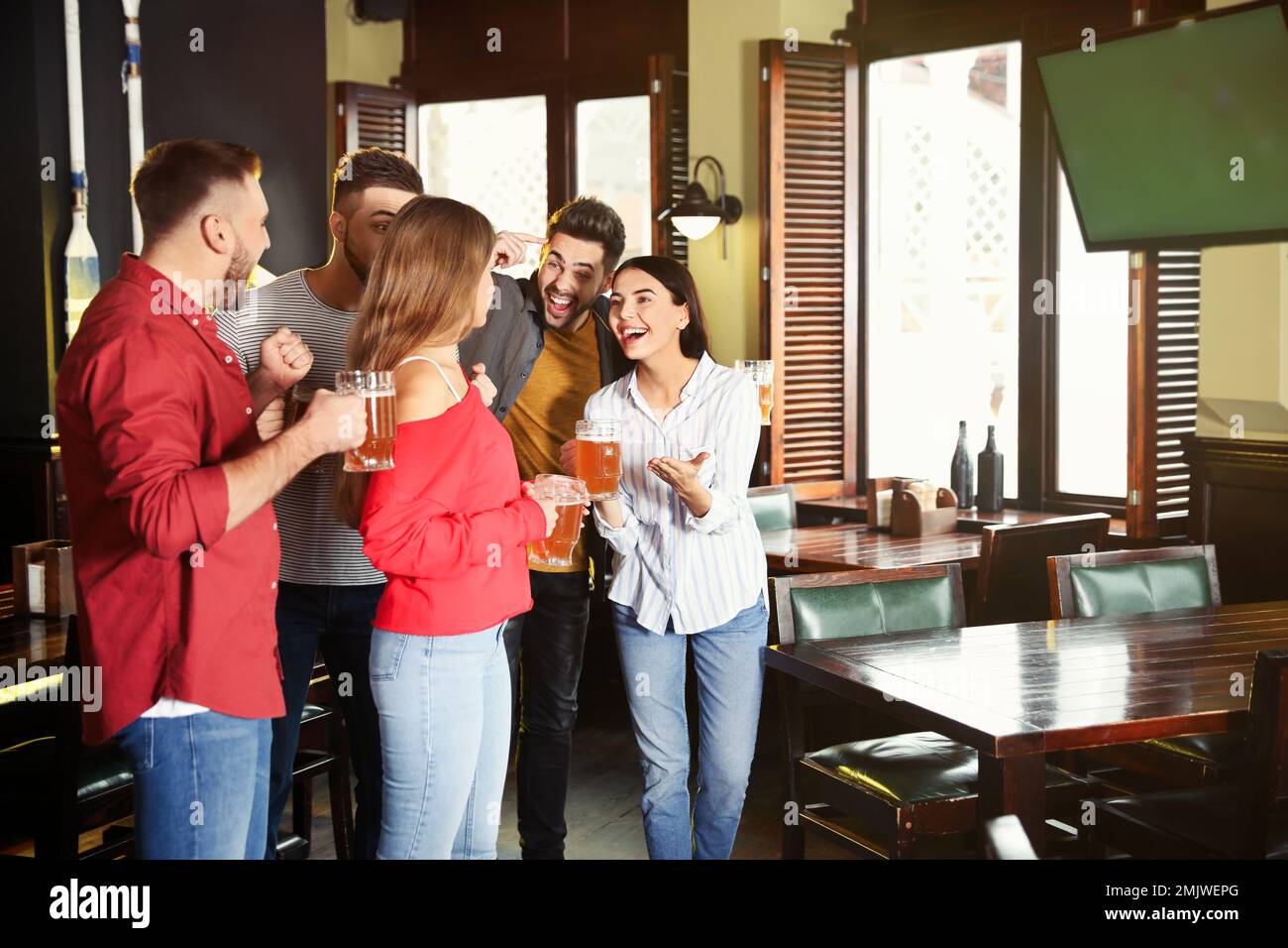 Group of football fans in sport bar Stock Photo - Alamy