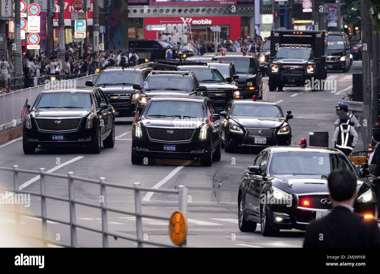 Motorcade of U.S. President Donald Trump and first lady Melania Trump ...