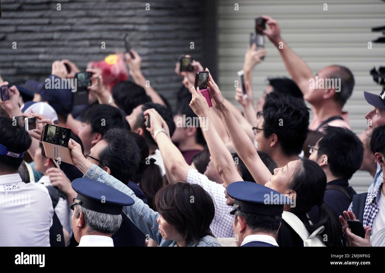 People see the motorcade of U.S. President Donald Trump and first lady ...