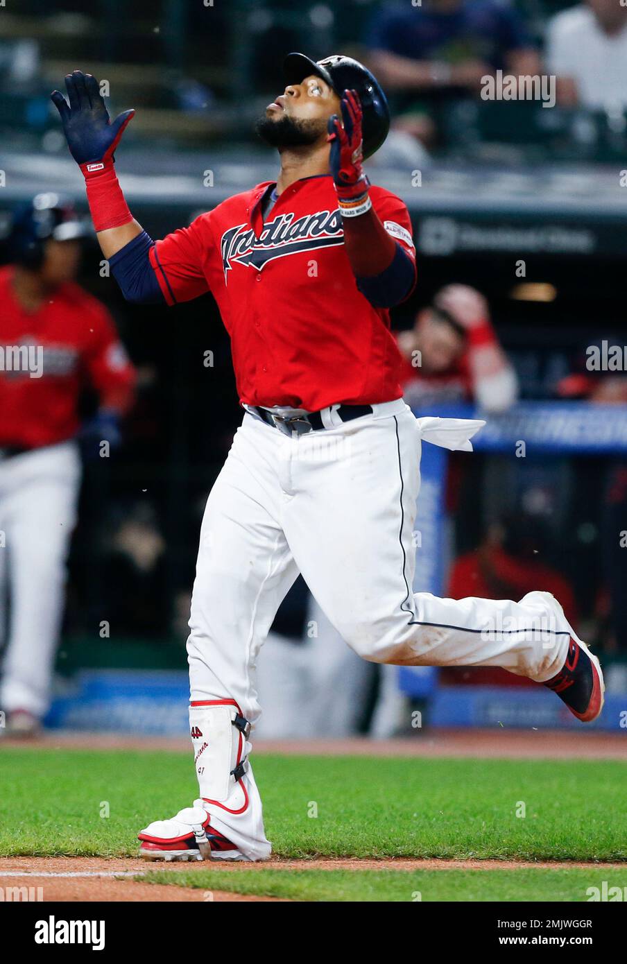 Cleveland Indians' Carlos Santana rounds the bases after hitting a solo ...