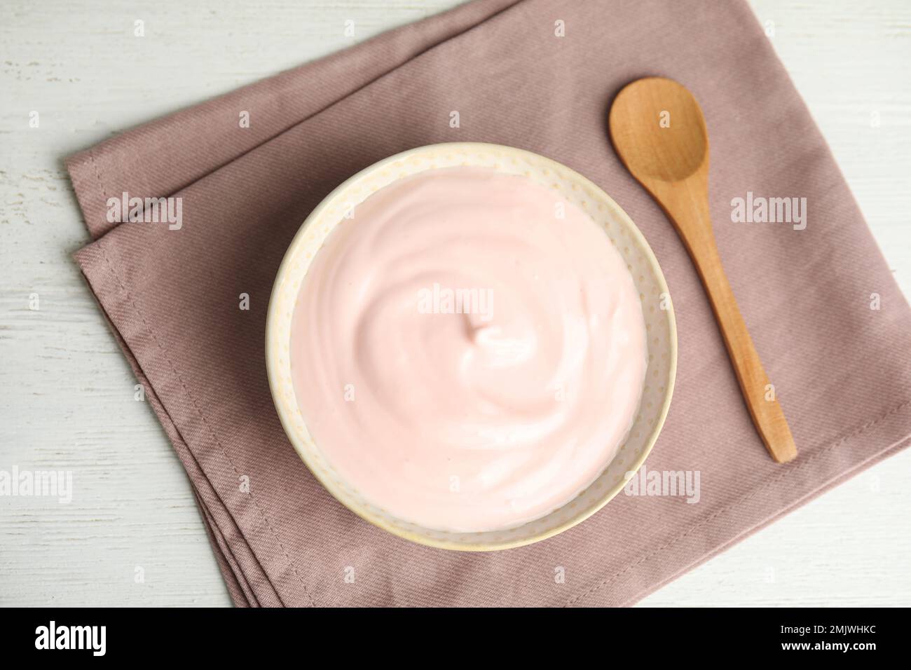 Tasty organic yogurt on white wooden table, top view Stock Photo - Alamy