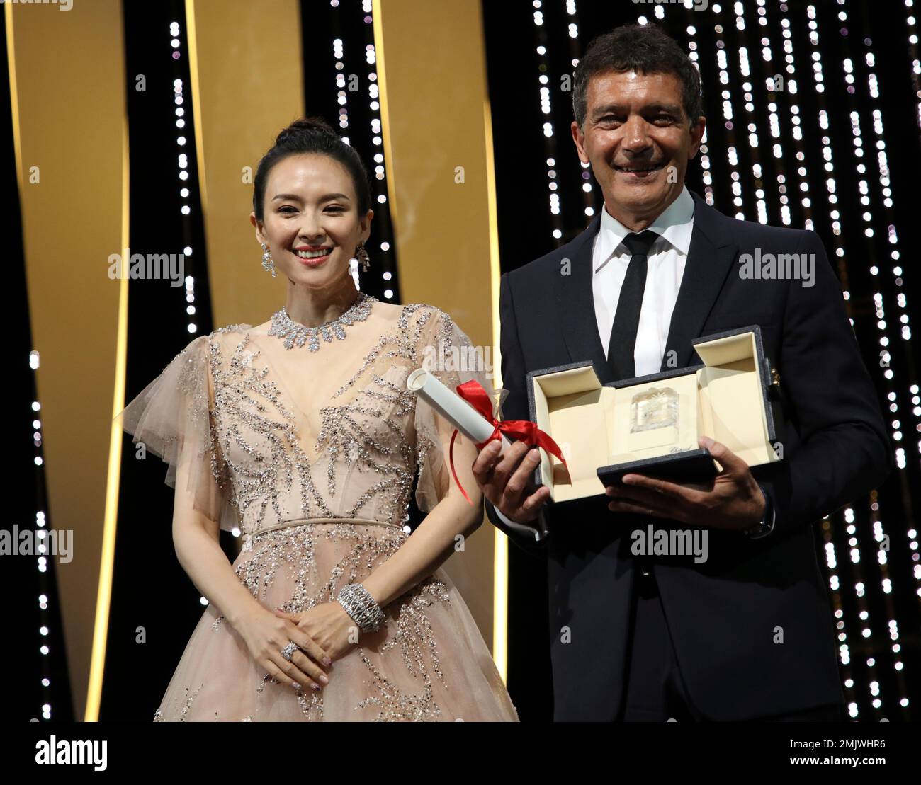 Actor Antonio Banderas, right, holds the best actor award for the film ...