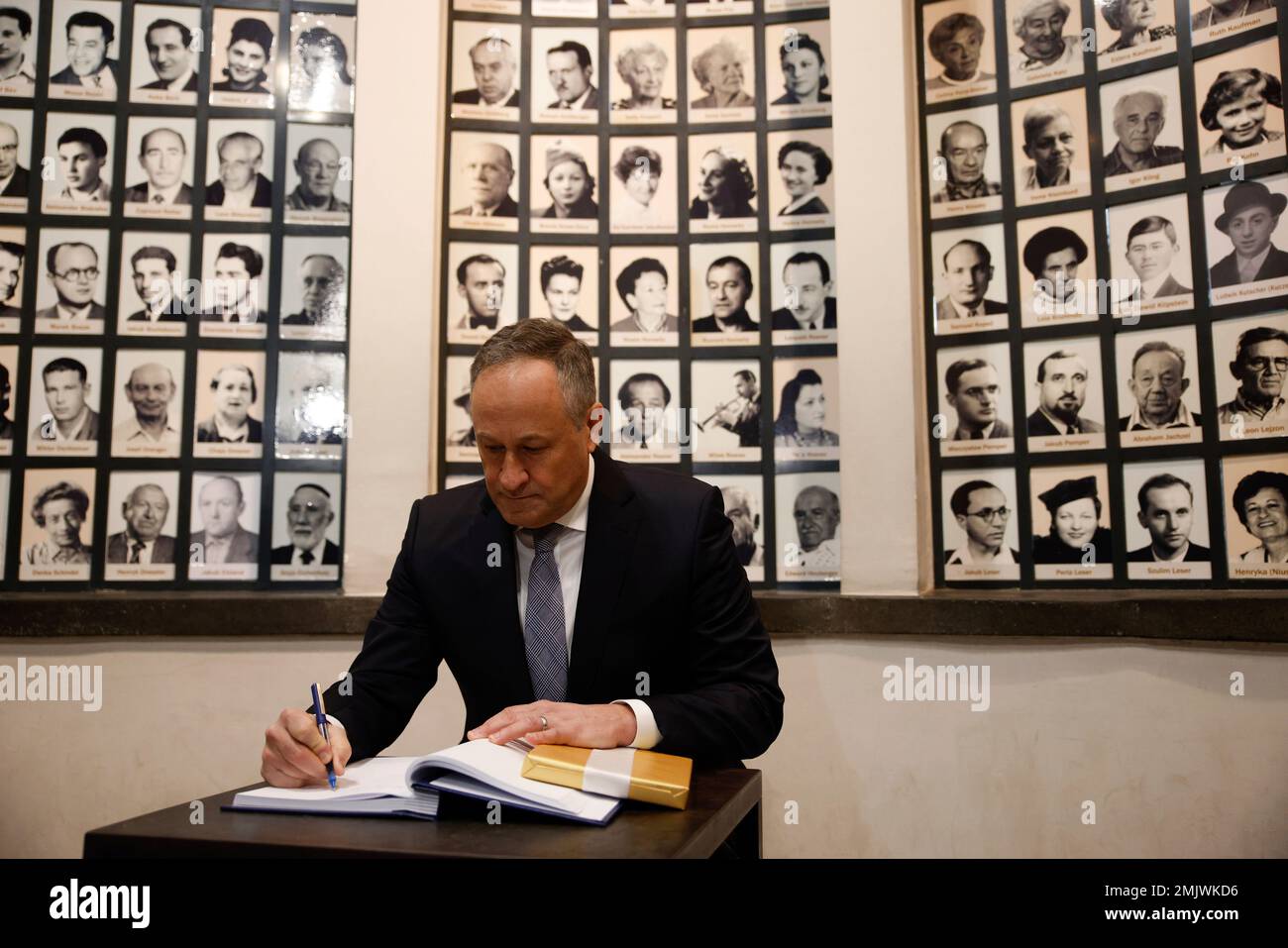 U.S. Second Gentleman, Douglas Emhoff, signs a guest book as he visits ...