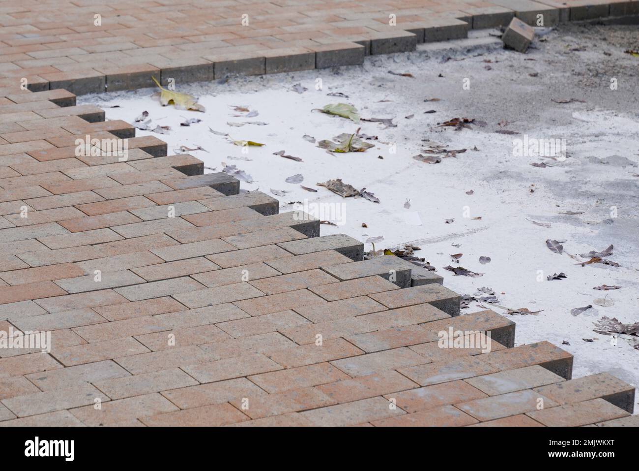 Repair work on city street paving brick with self-locking blocks Stock ...