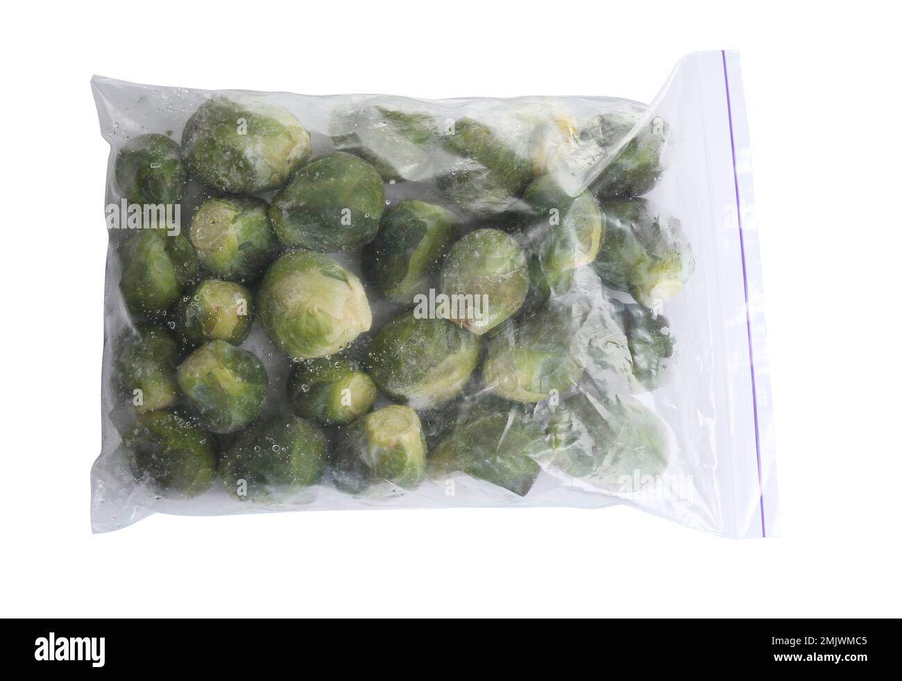 Frozen Brussels sprouts in plastic bag isolated on white, top view ...