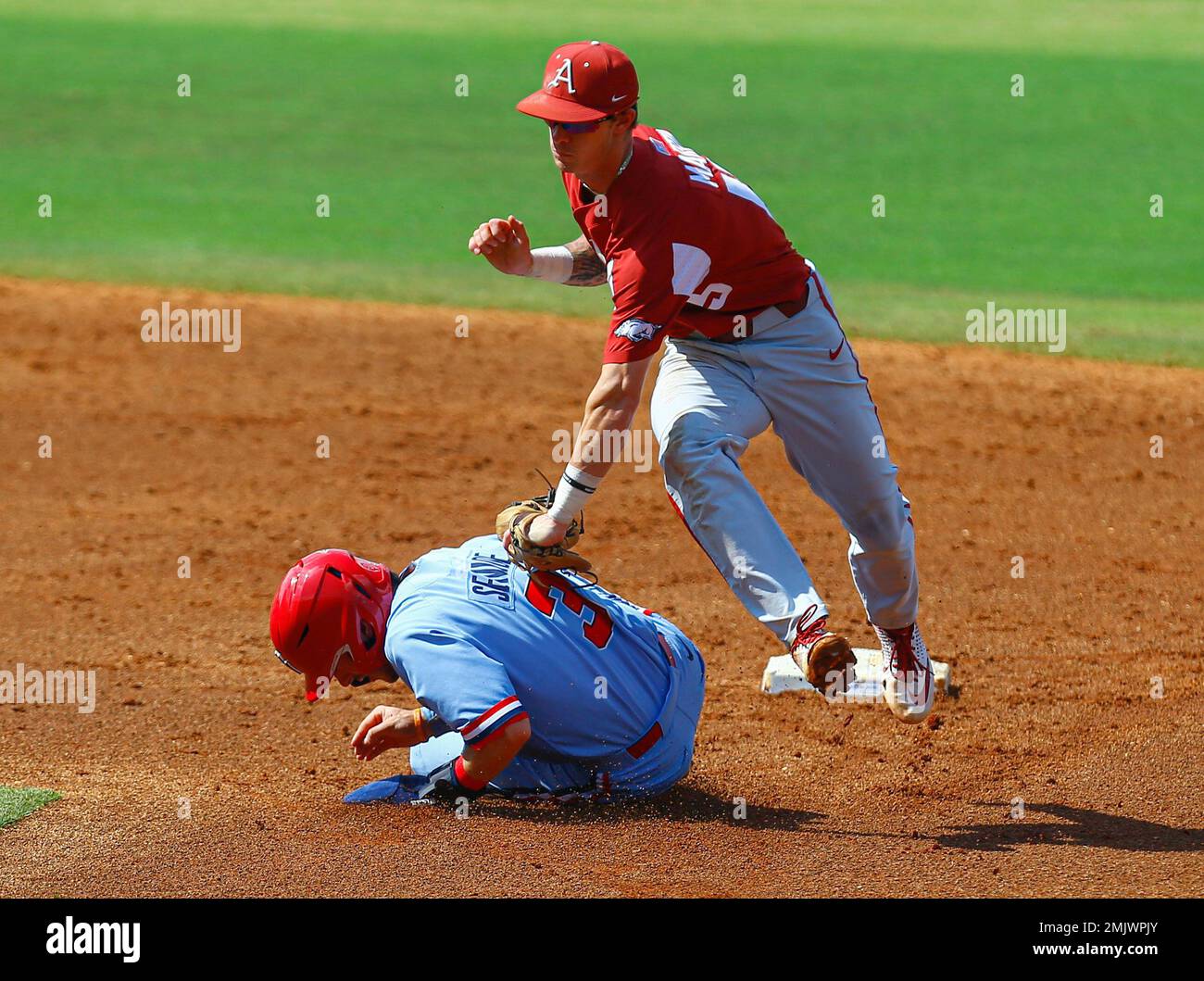 Mississippi's Anthony Servideo (3) is tagged out by Arkansas shortstop ...