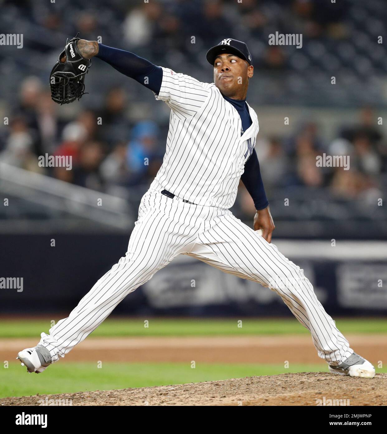 New York Yankees relief pitcher Aroldis Chapman winds up in a baseball ...