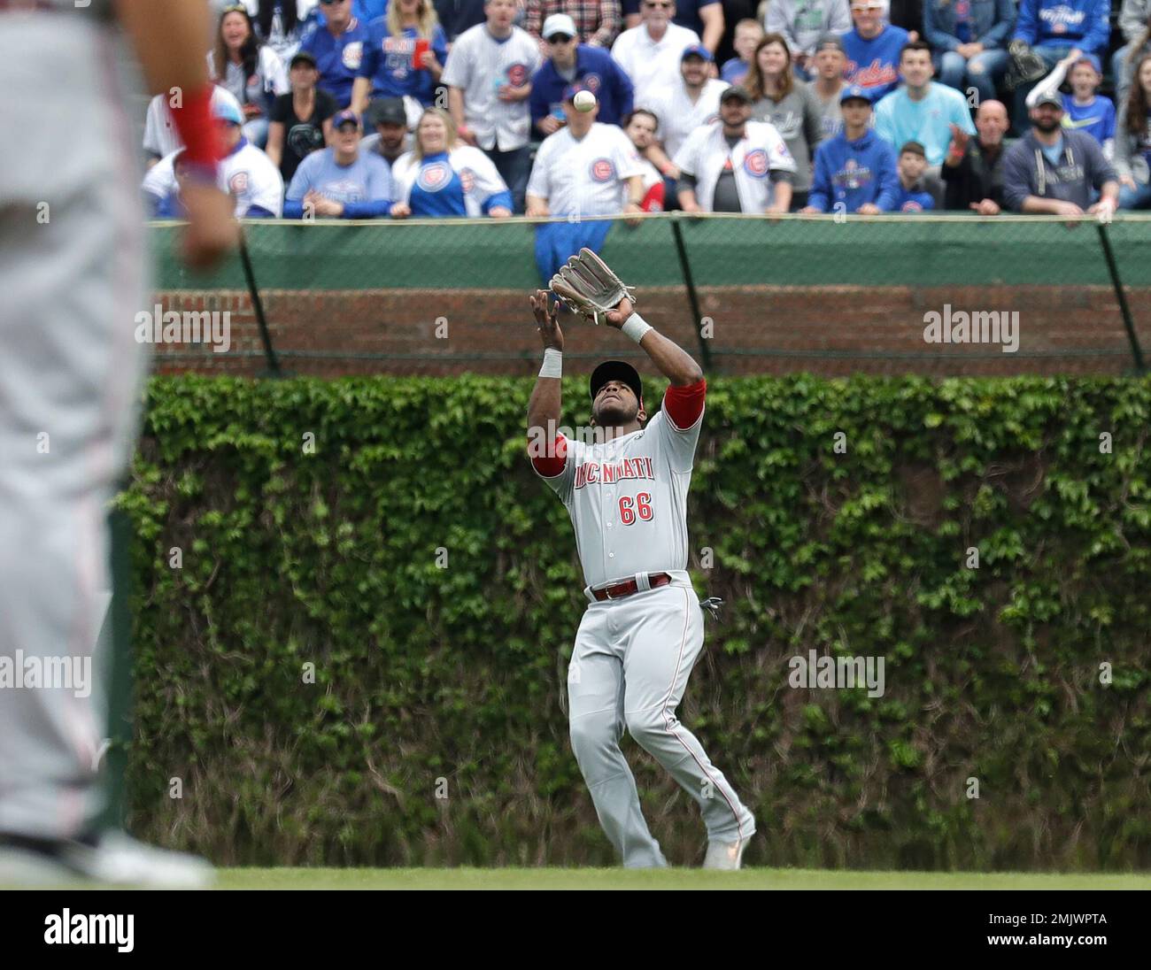 Cincinnati Reds right fielder Yasiel Puig catches a fly ball by Chicago ...