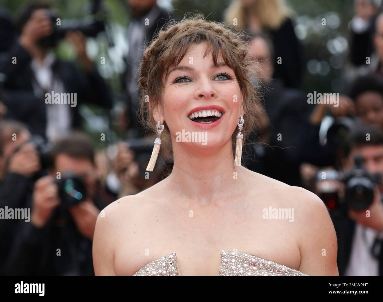 Actress Milla Jovovich poses for photographers upon arrival at the ...