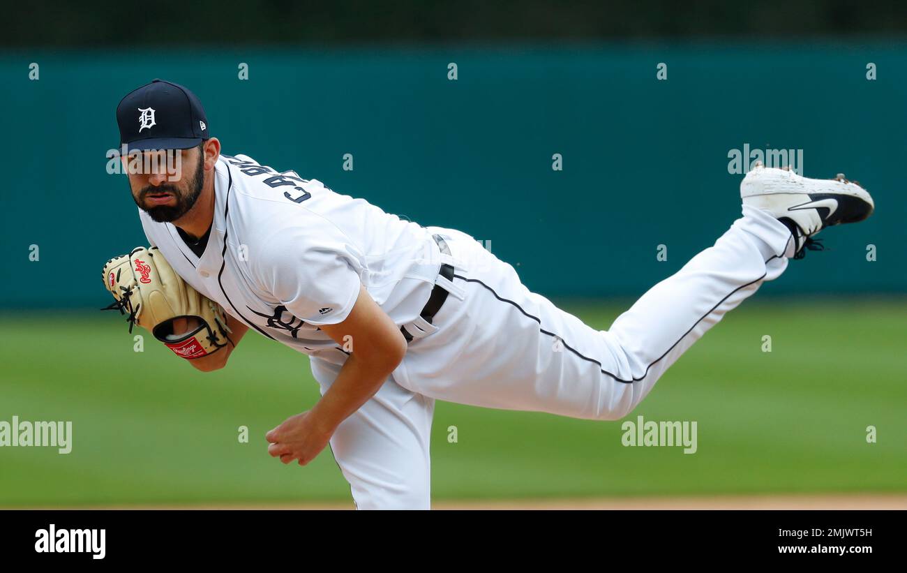 Detroit Tigers pitcher Ryan Carpenter throws a warmup pitch against the ...