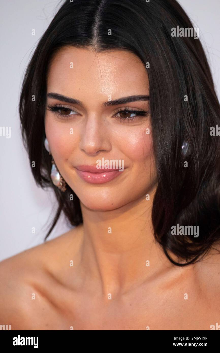 Model Kendall Jenner poses for photographers upon arrival at the amfAR ...