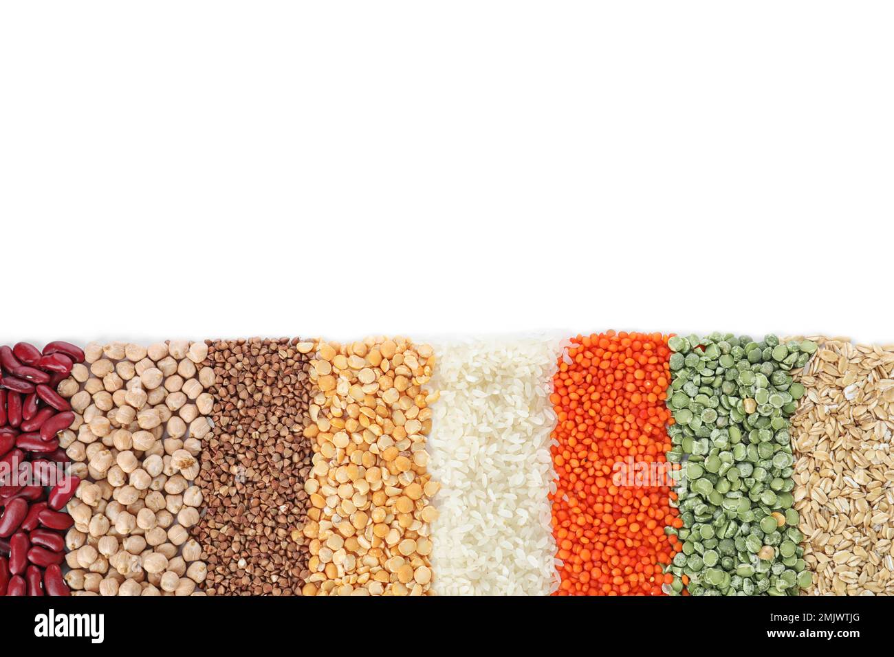 Different types of legumes and cereals on white background, top view ...
