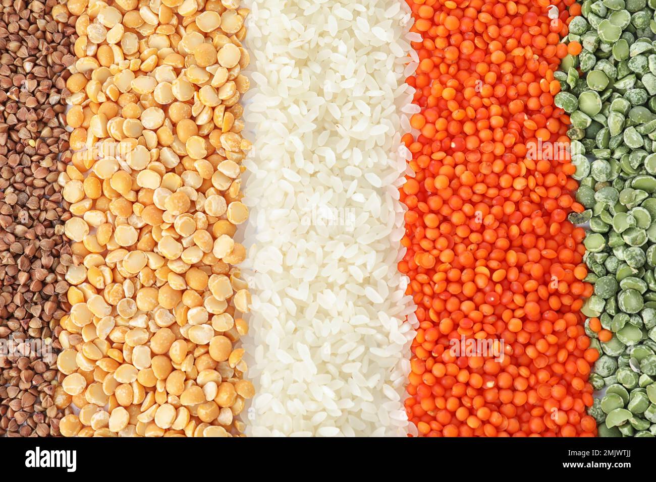 Different types of legumes and cereals as background, top view. Organic ...