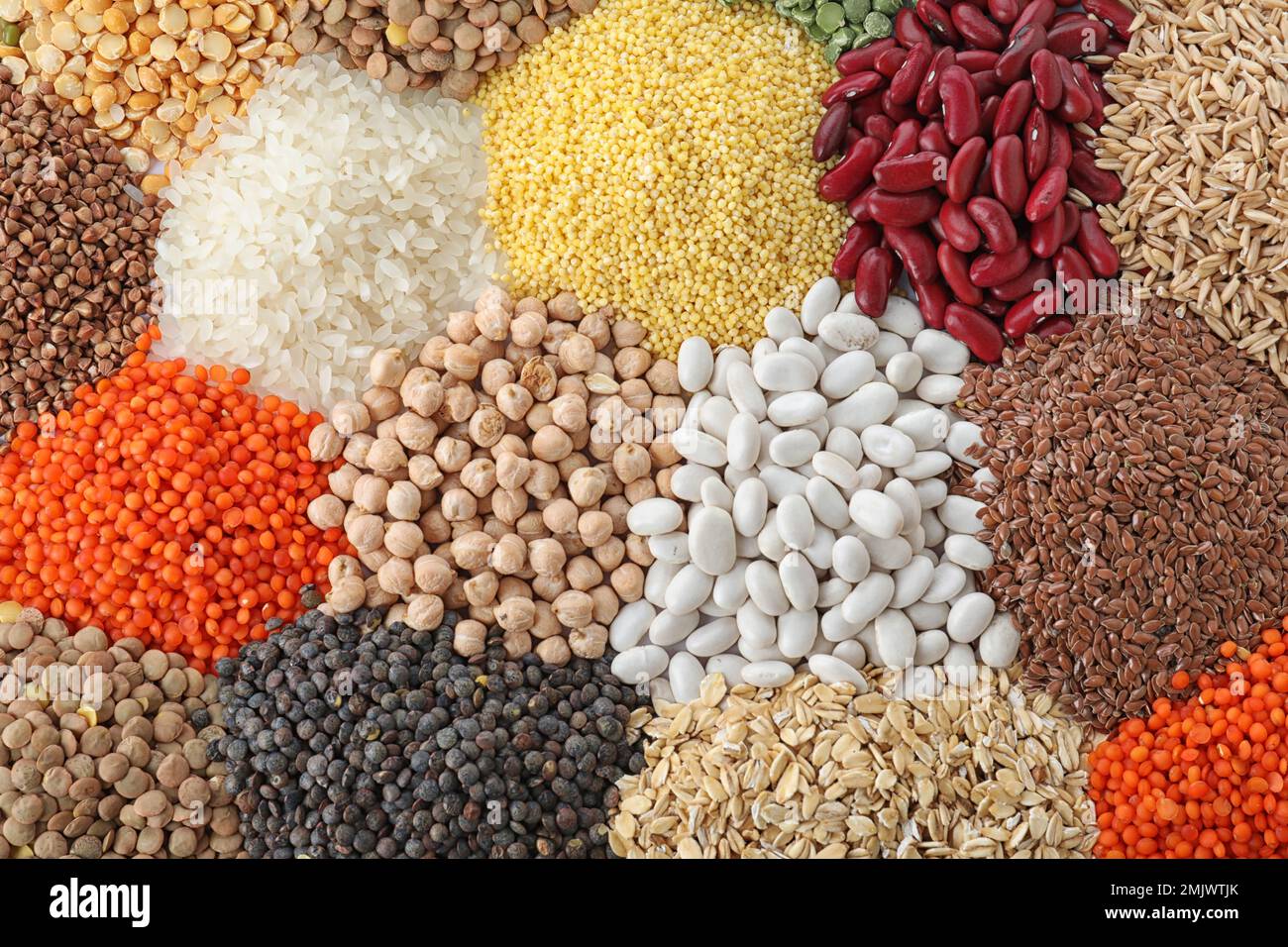 Different types of legumes and cereals as background, top view. Organic ...