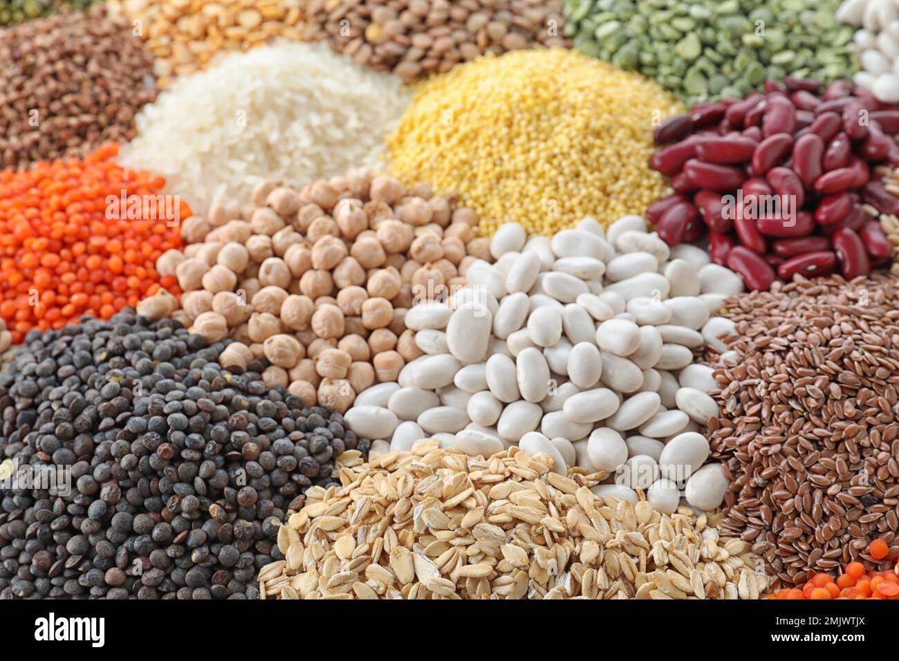 Different types of legumes and cereals as background, closeup. Organic ...