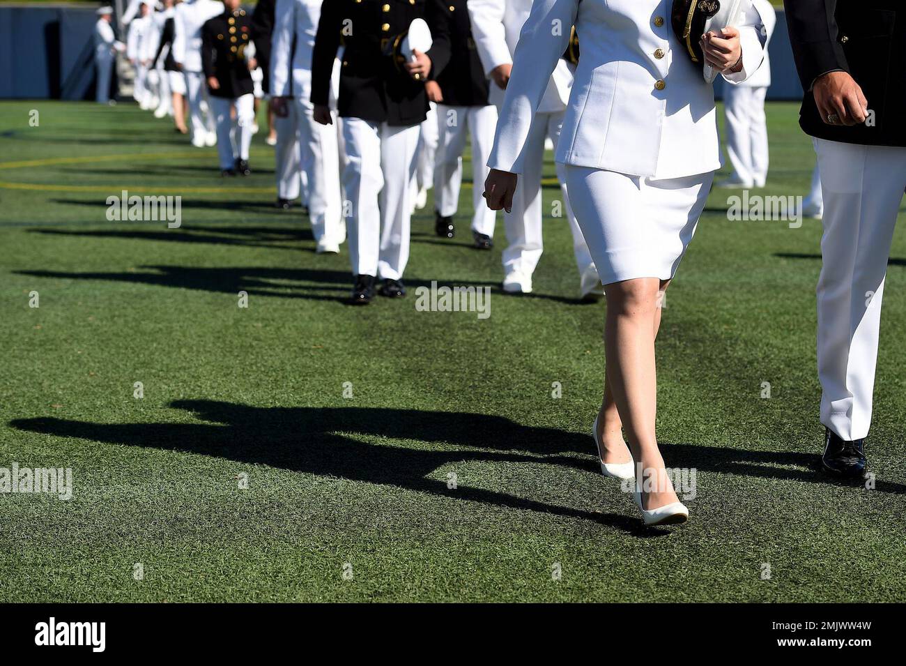 Graduating U.S Naval Academy midshipmen walk into the academy's ...