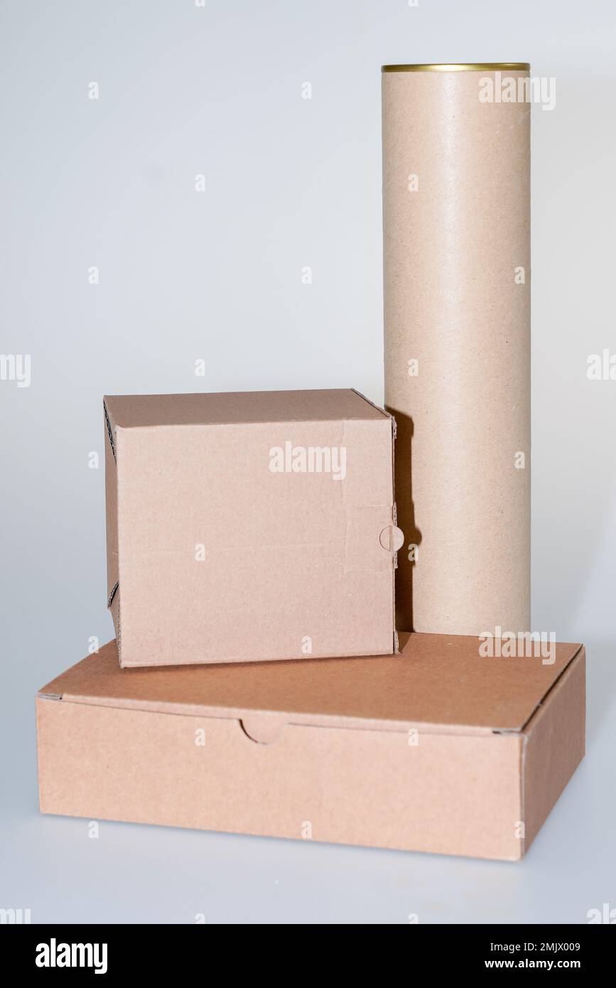 piles of three cardboard boxes on grey white background Stock Photo - Alamy