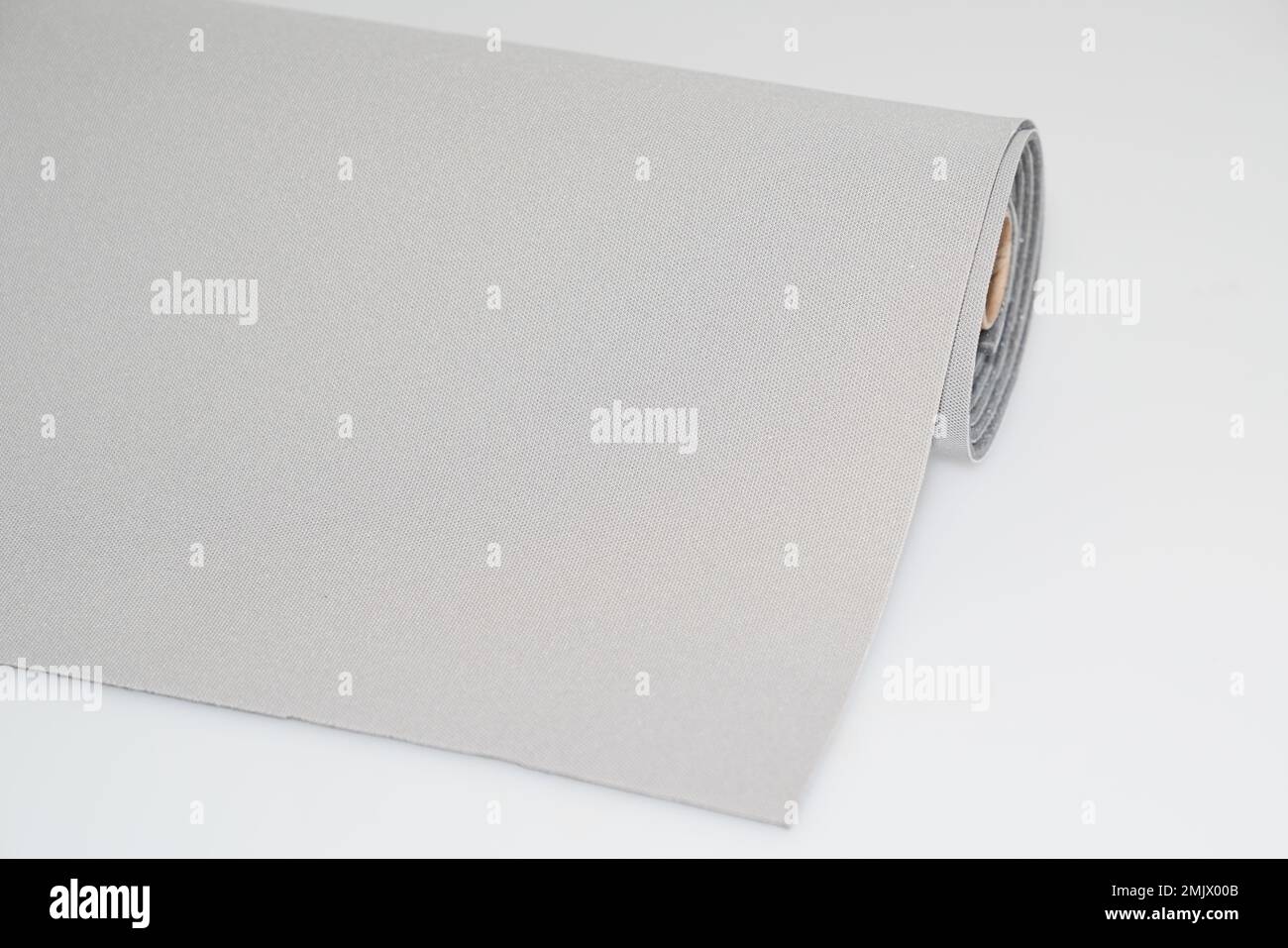 sample grey textile fabric roll ready to cut on gray background Stock ...