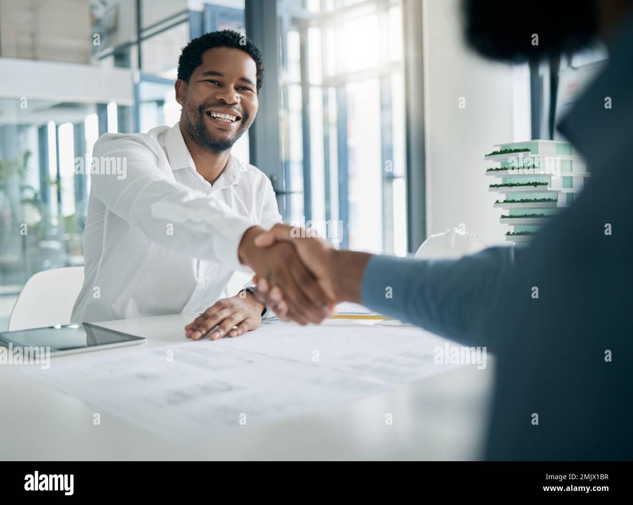 Black man, handshake and architecture with architect recruitment, job ...