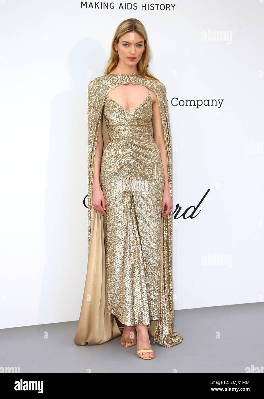 Model Martha Hunt poses for photographers upon arrival at the amfAR ...