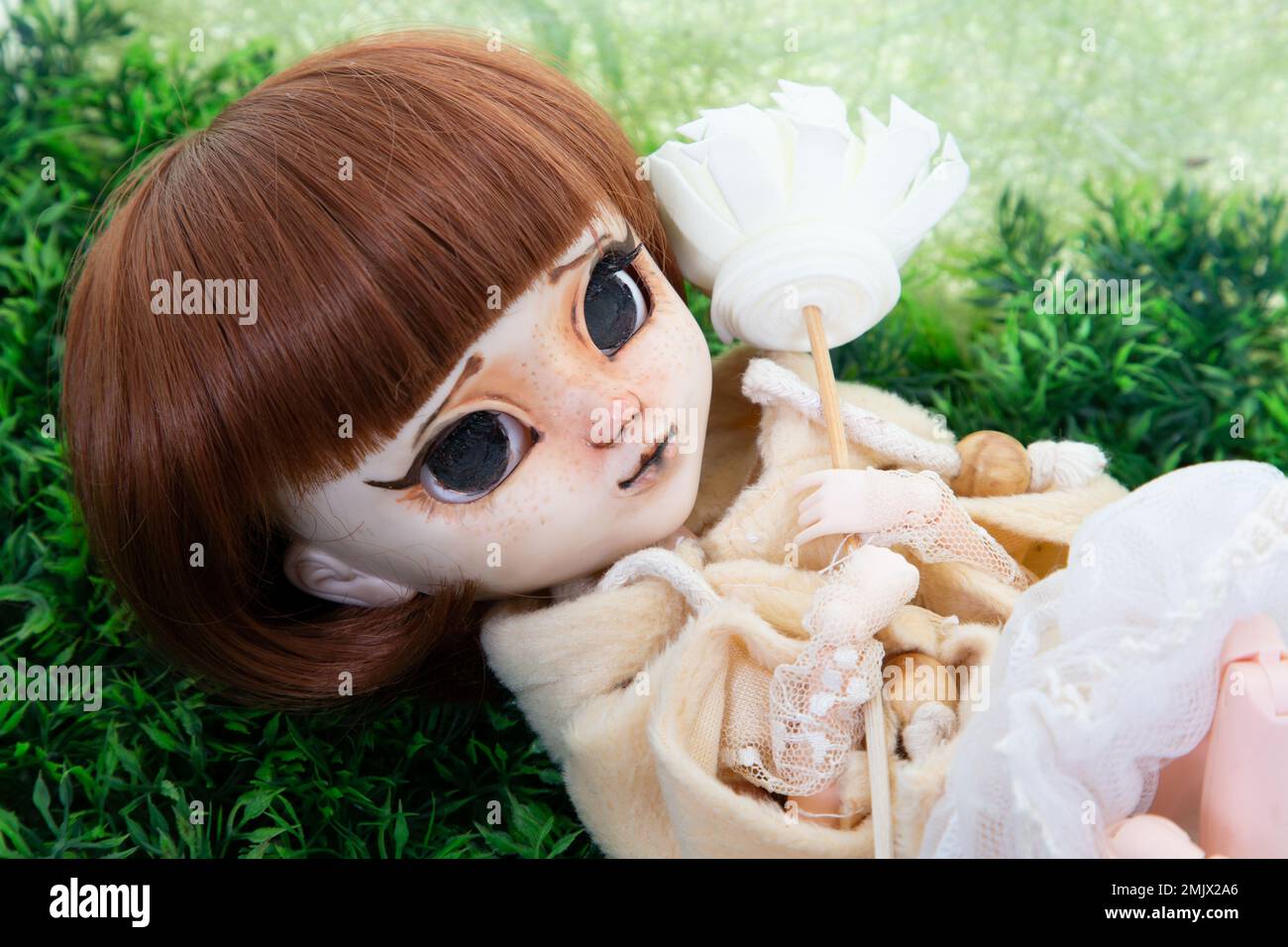 doll expressive with big eyes scary plastic face portrait in green ...