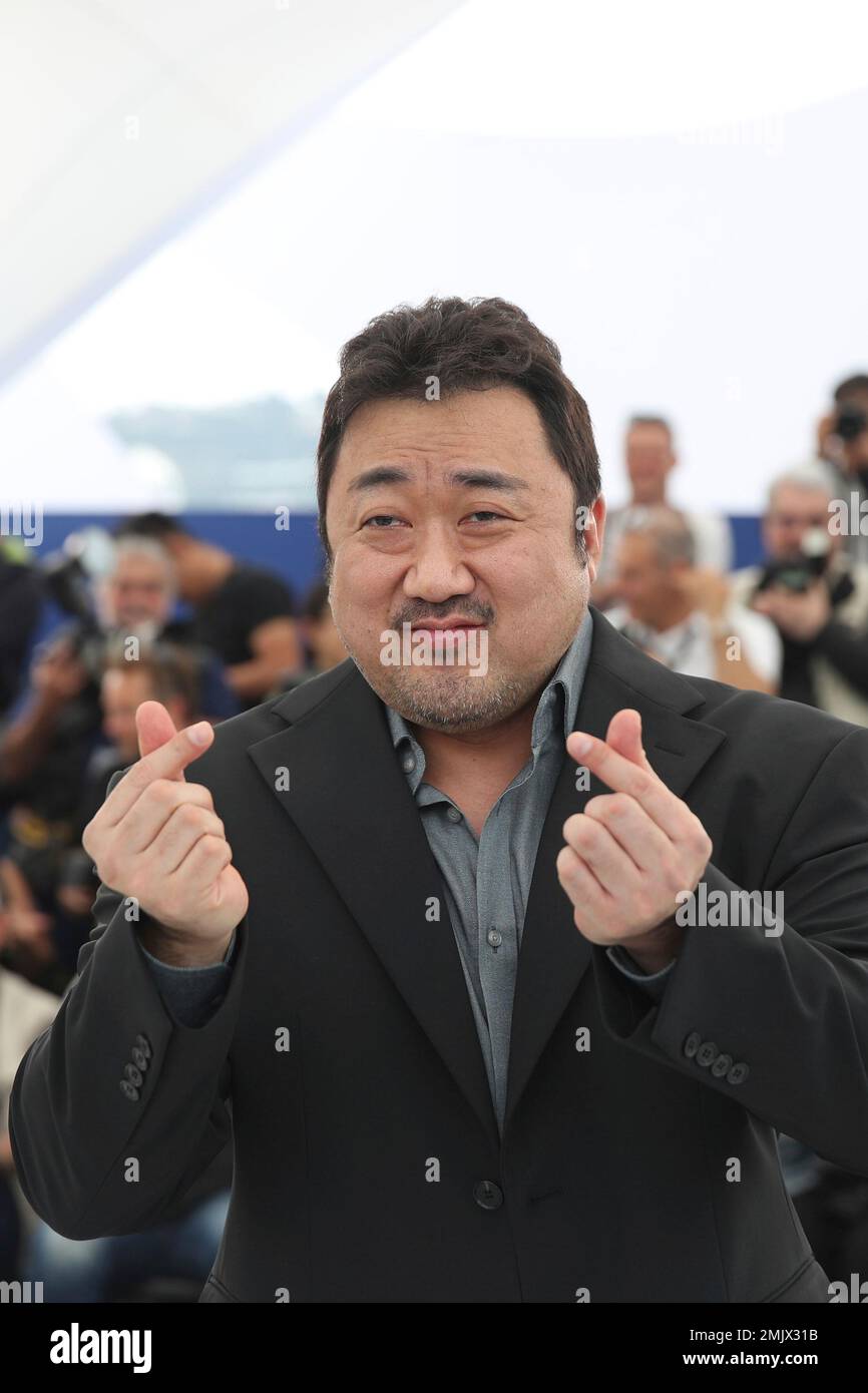 Actor Lee Don poses for photographers at the photo call for the film ...