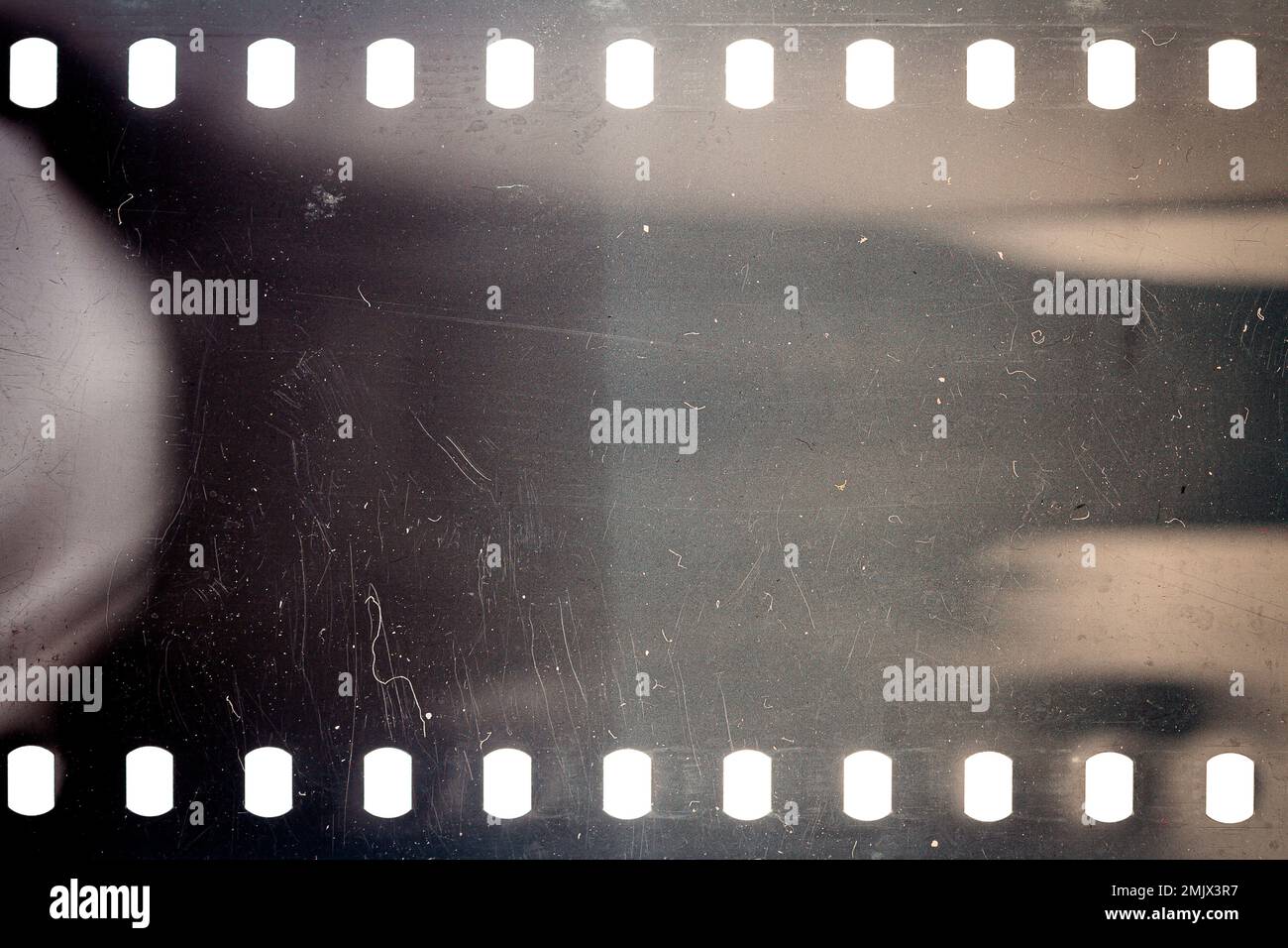 Dusty and grungy 35mm film texture or surface. Perforated scratched ...