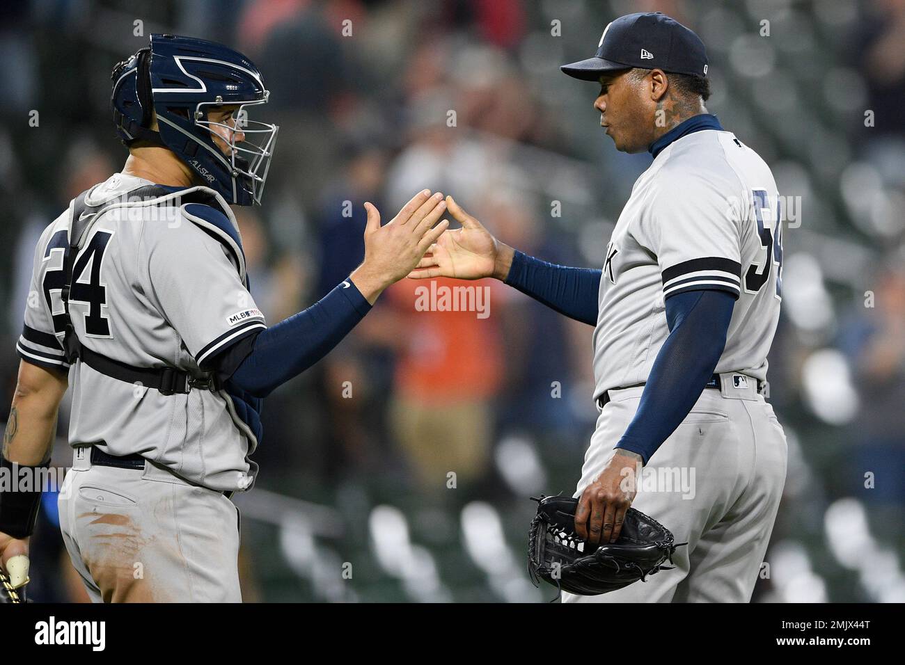 New York Yankees relief pitcher Aroldis Chapman, right, celebrates with ...