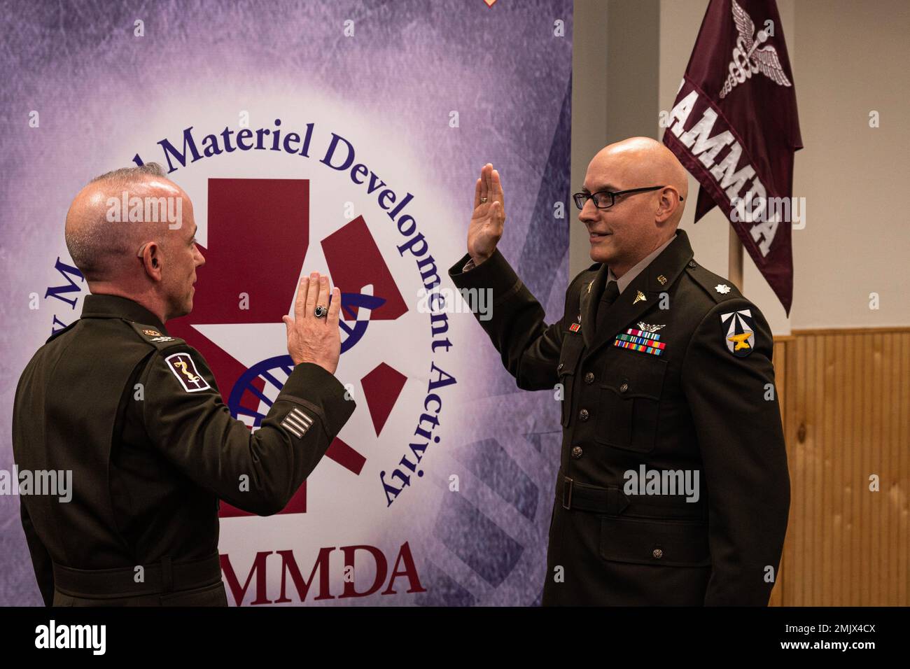 Col. Andy Nuce administers the Oath of Office to newly promoted Lt. Col ...