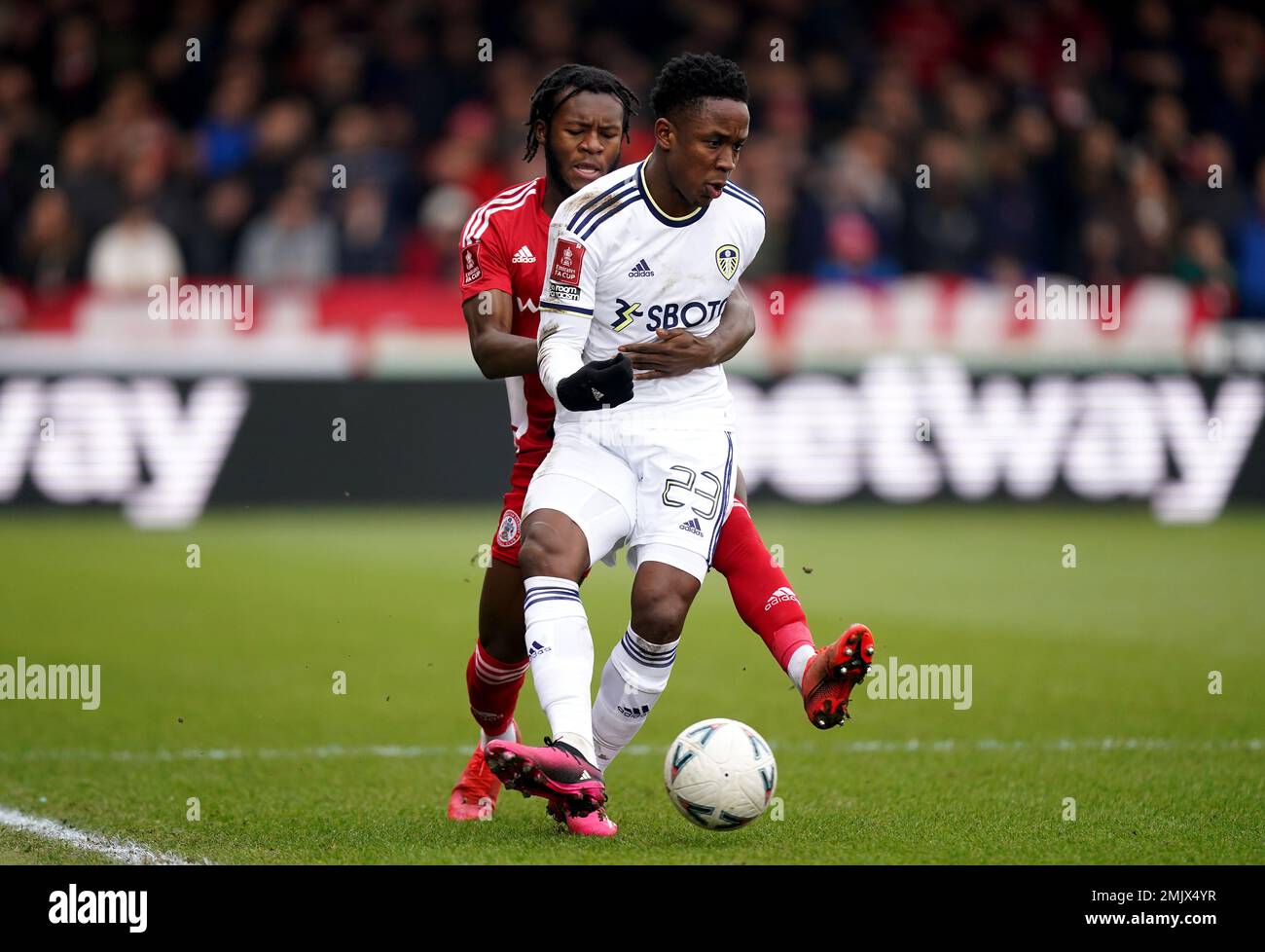 Accrington Stanley's Rosarie Longelo (left) pulls back on Leeds United ...
