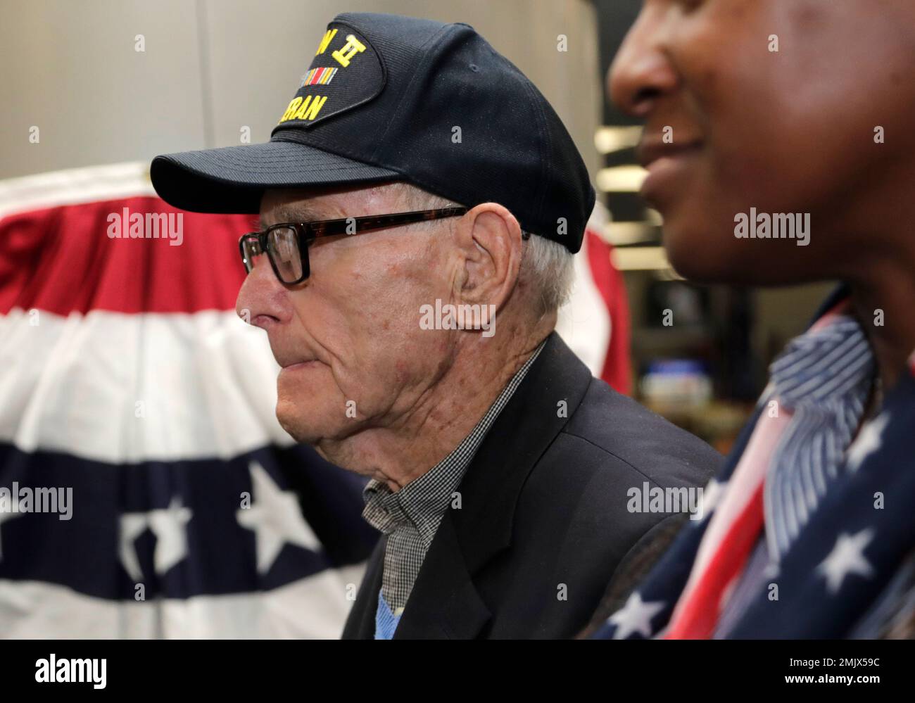 WWll veteran Sydney Levit, 94, of Aventura, Fla., stands during a ...