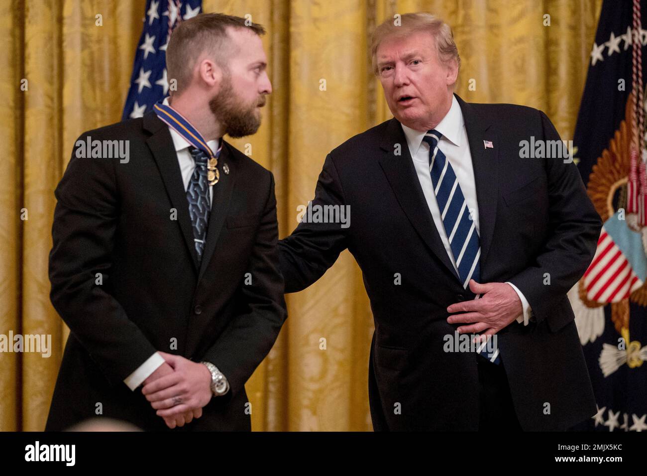 President Donald Trump speaks with Senior Trooper Nicholas Cederberg ...