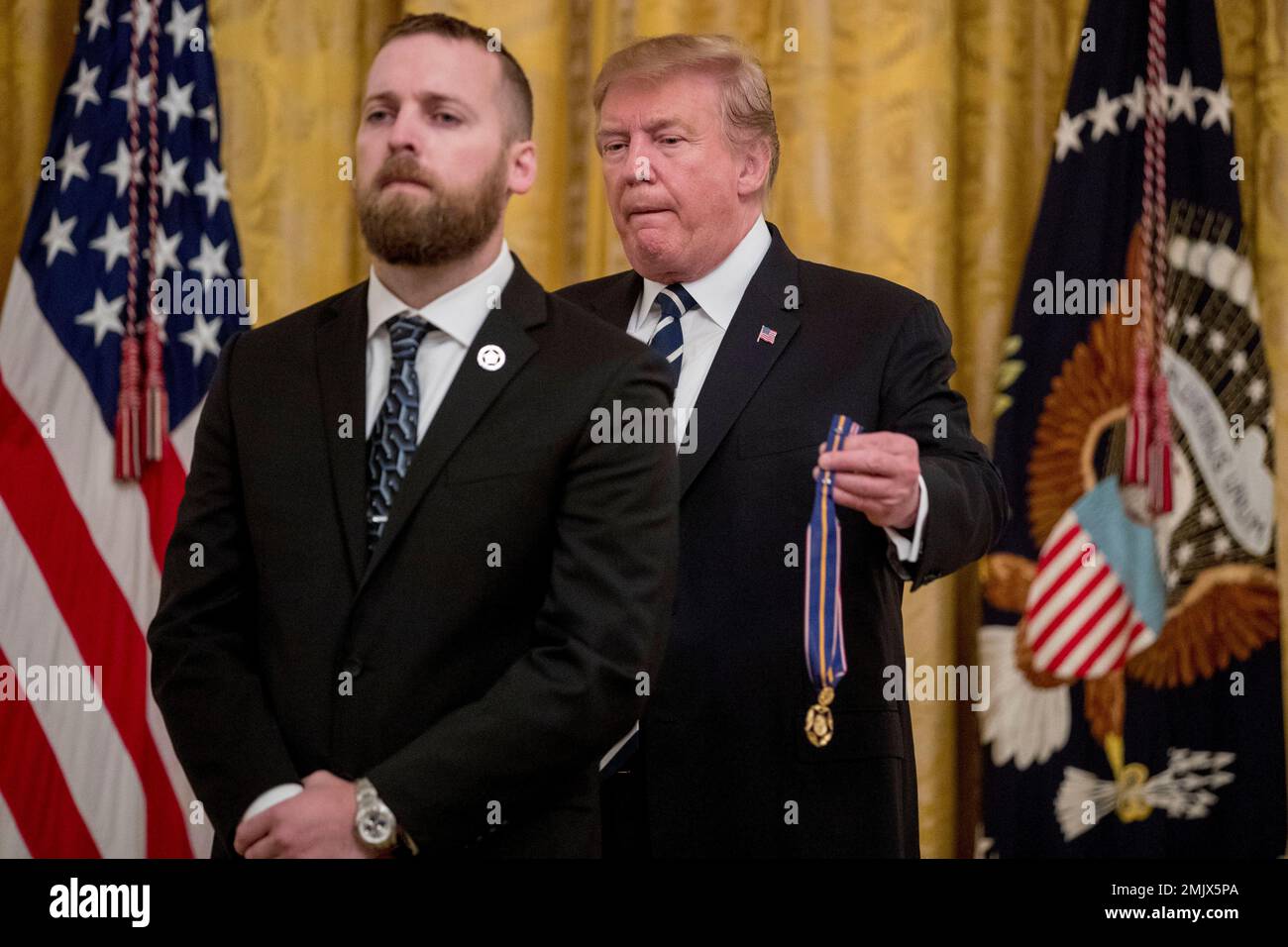 President Donald Trump awards Senior Trooper Nicholas Cederberg the ...