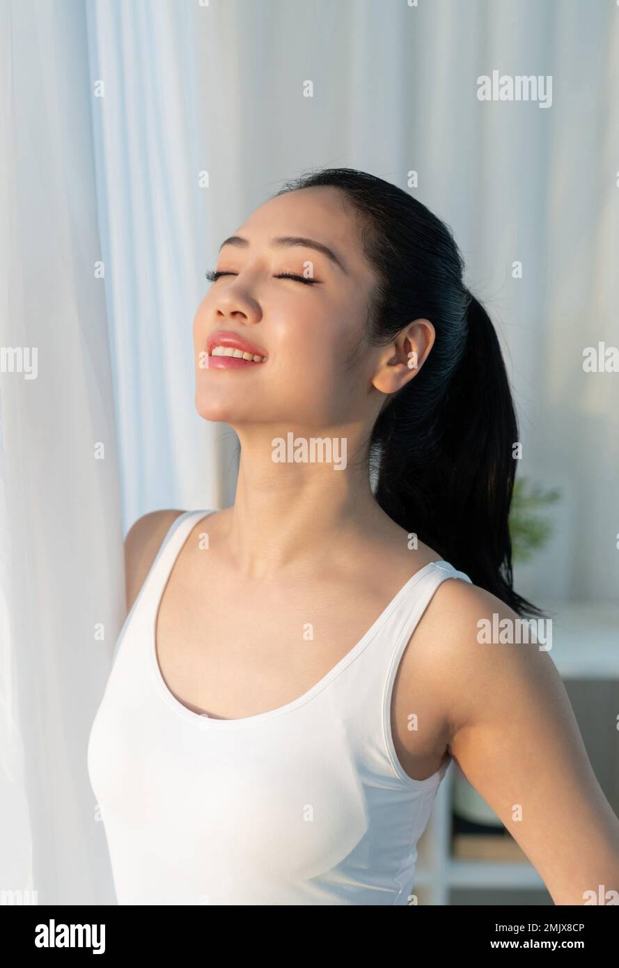 Happy young lady in the morning Stock Photo - Alamy