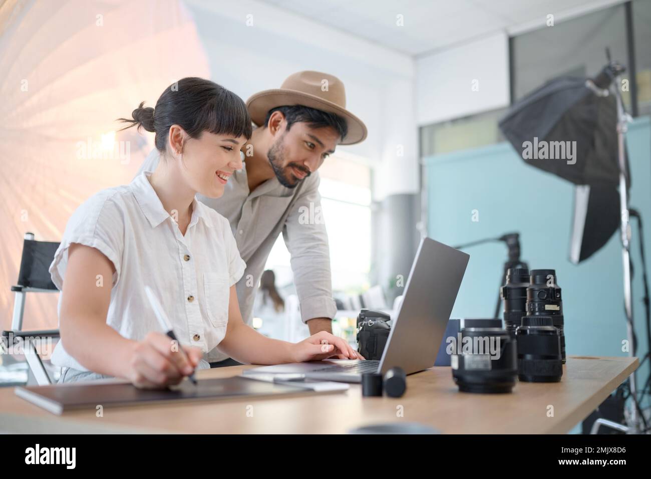 Happy, planning and photographers with work on a laptop, photo shoot ...