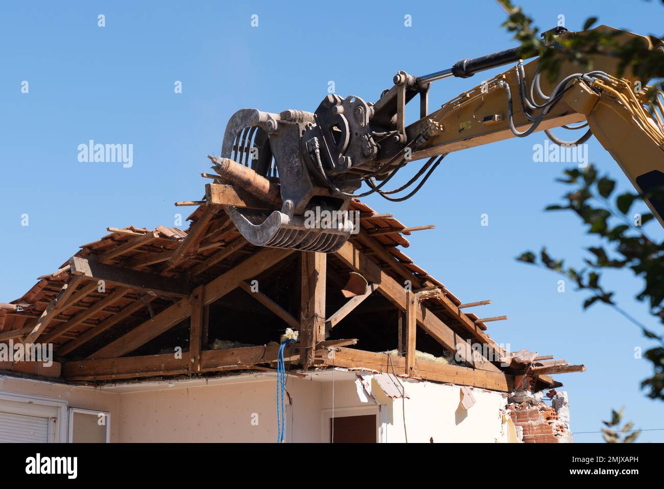 industrial excavator working demolition of house old residential ...