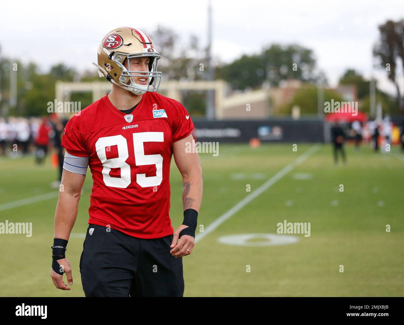 San Francisco 49ers' George Kittle (85) runs through a drill during a ...