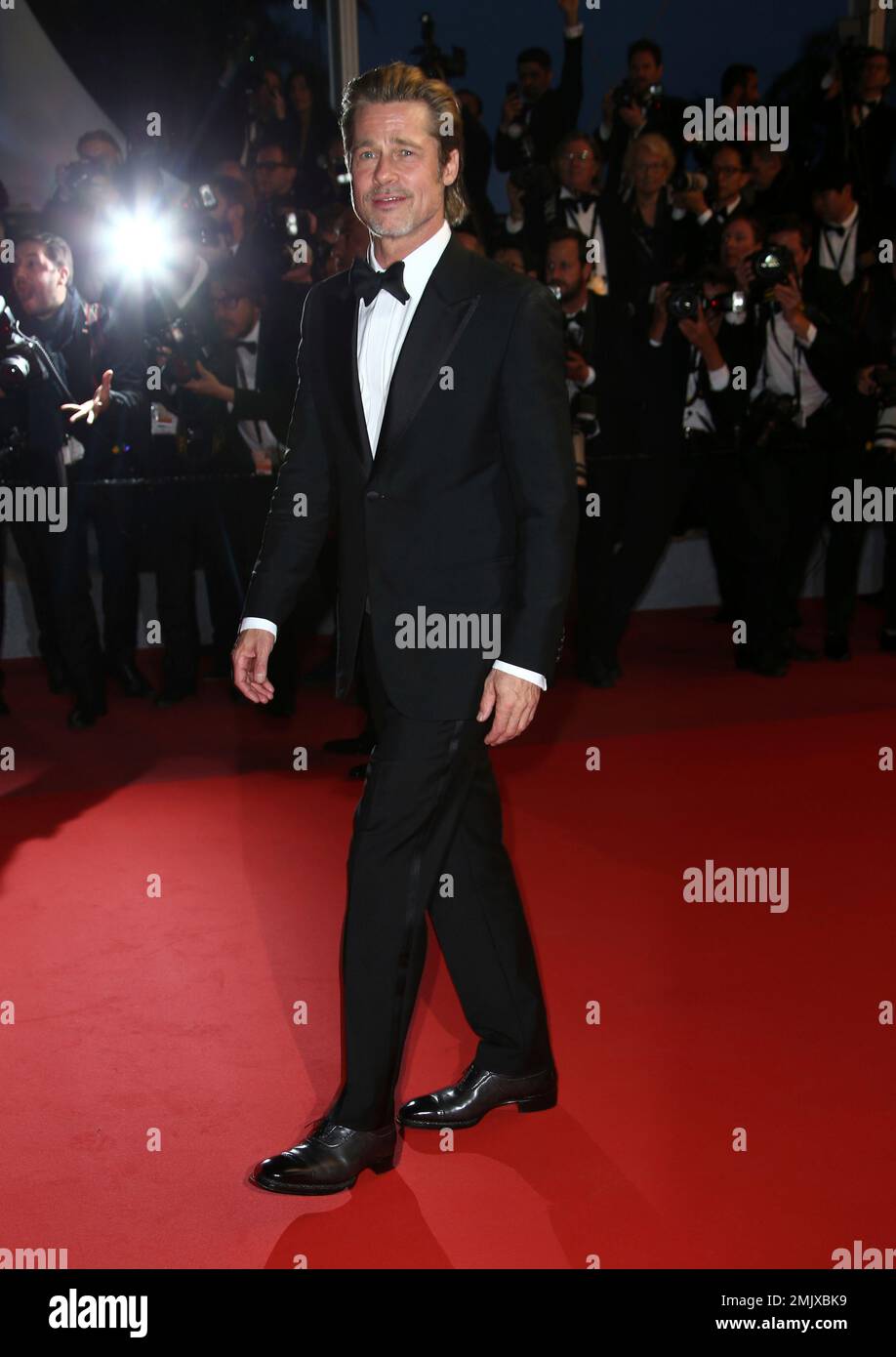 Actor Brad Pitt poses for photographers upon departure from the ...