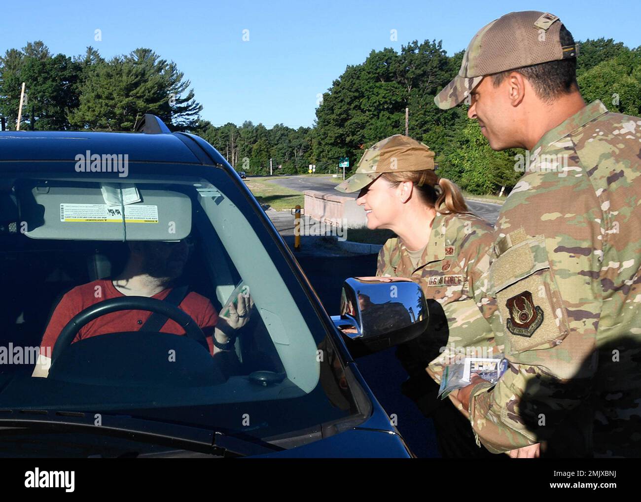 Col. Taona Enriquez, installation commander, and Chief Master Sgt. Alan ...