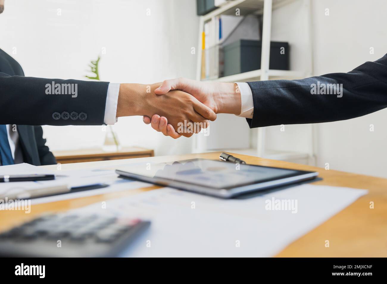 Businessmen making handshake greeting hi-res stock photography and ...